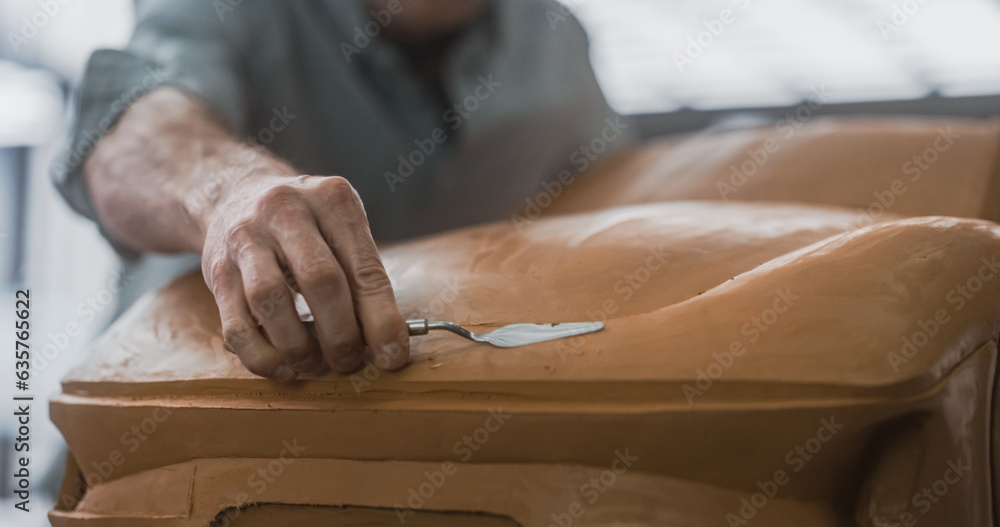 Close Up of an Automotive Designer Sculpting a 3D Clay Model of a New ...