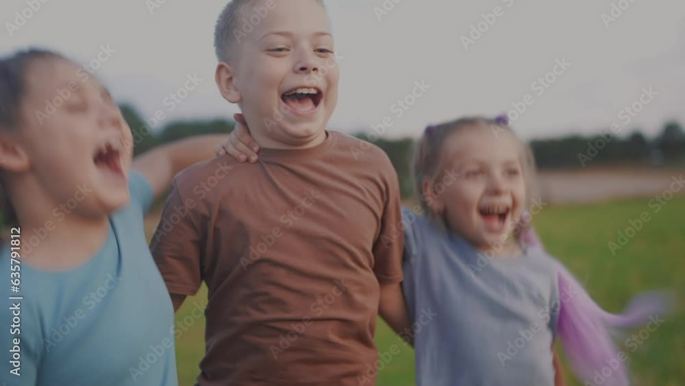 Vidéo Stock team children hugging jumping shouting rejoice success ...