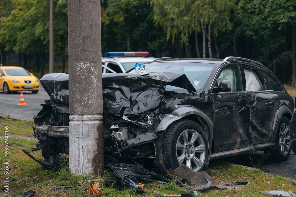 Broken bumper and hood of a car as a result of a collision with a pole ...