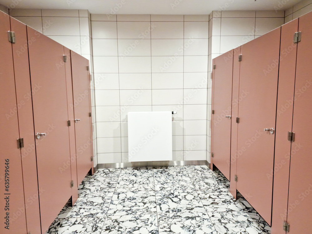 in public building there are women toilets with pink doors. commercial ...