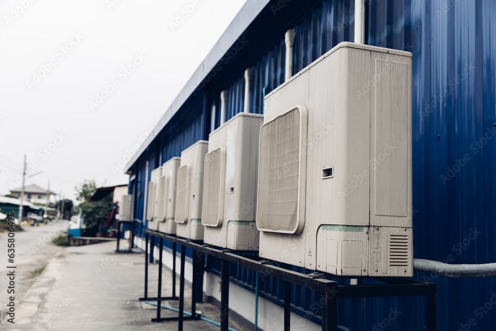 Air conditioner compressor installed in old building. Outdoor split ...