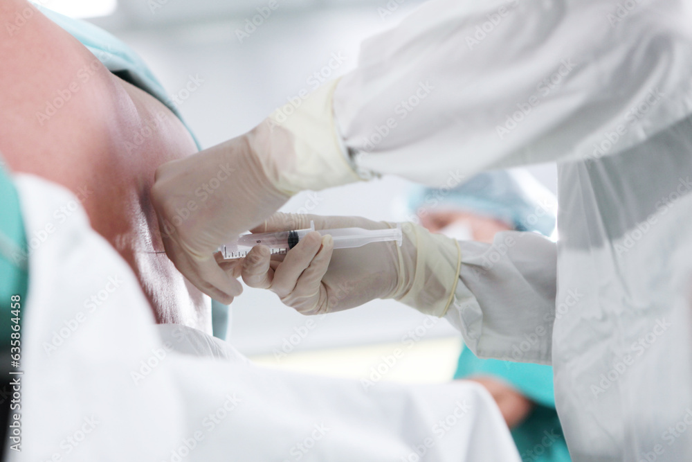 Epidural anesthesia. Injection for spinal anesthesia.An ...