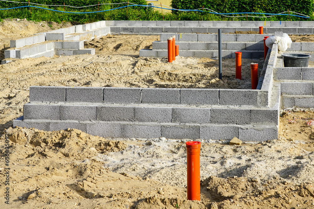 Photo Building the foundation of the house from concrete blocks and ...