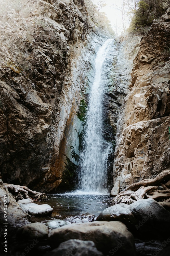 Vertical shot of the majestic Millomeris Waterfall, in Pano Platres ...