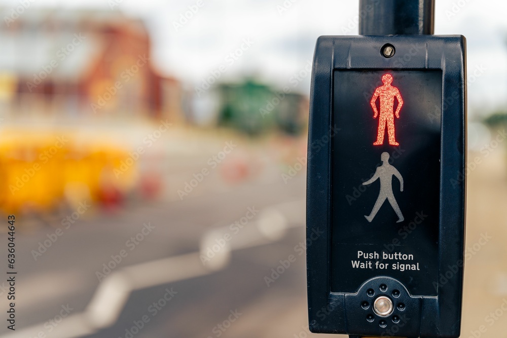 Closeup of a pedestrian crossing push button, traffic signal control ...