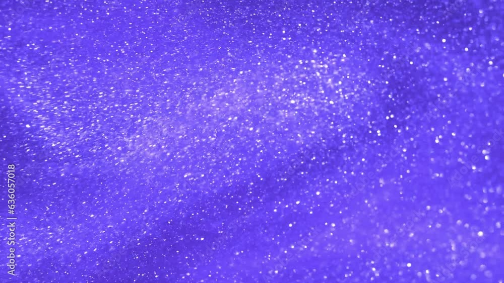 Chaotic layered motion of silvery dust particles in a blue fluid. Light ...