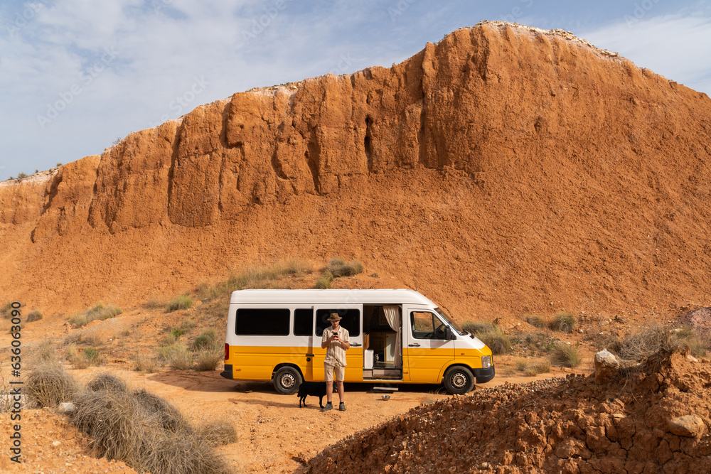 Man camping with camper van in nature Stock Photo | Adobe Stock