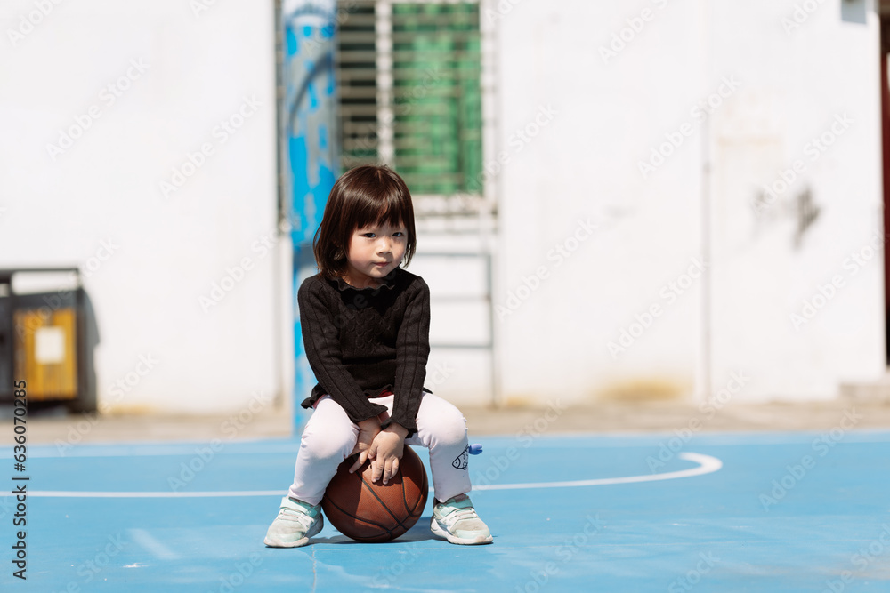 little girl playing basketball Stock Photo | Adobe Stock
