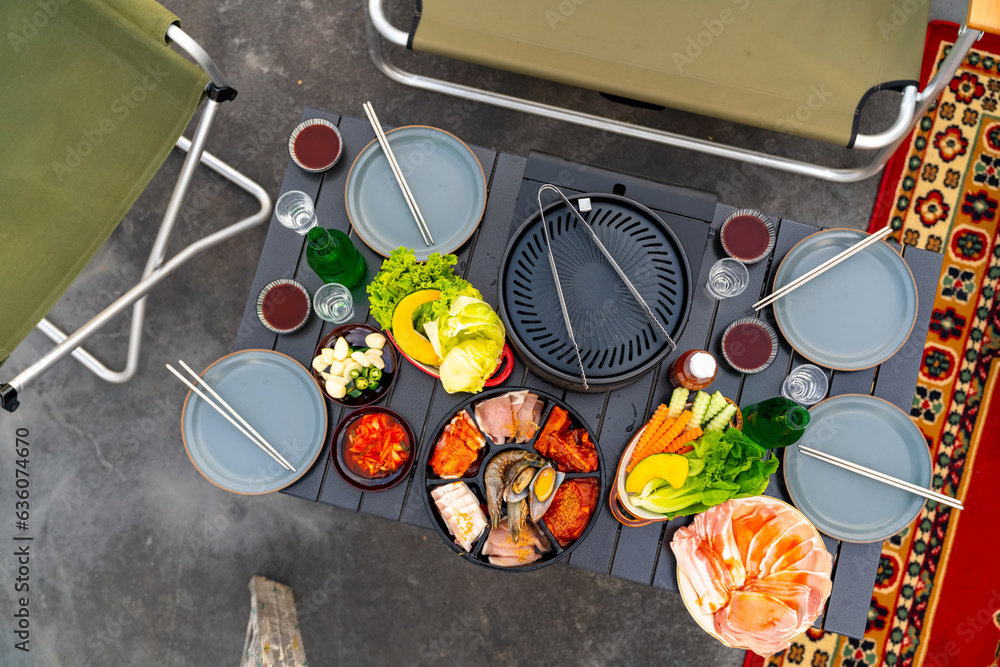 Korean food barbecue grill and alcohol drink vodka on the table. Asian ...