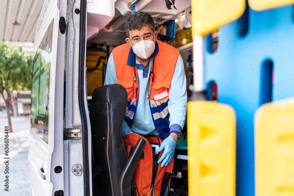 paramedic checking medical equipment on an ambulance Stock Photo ...