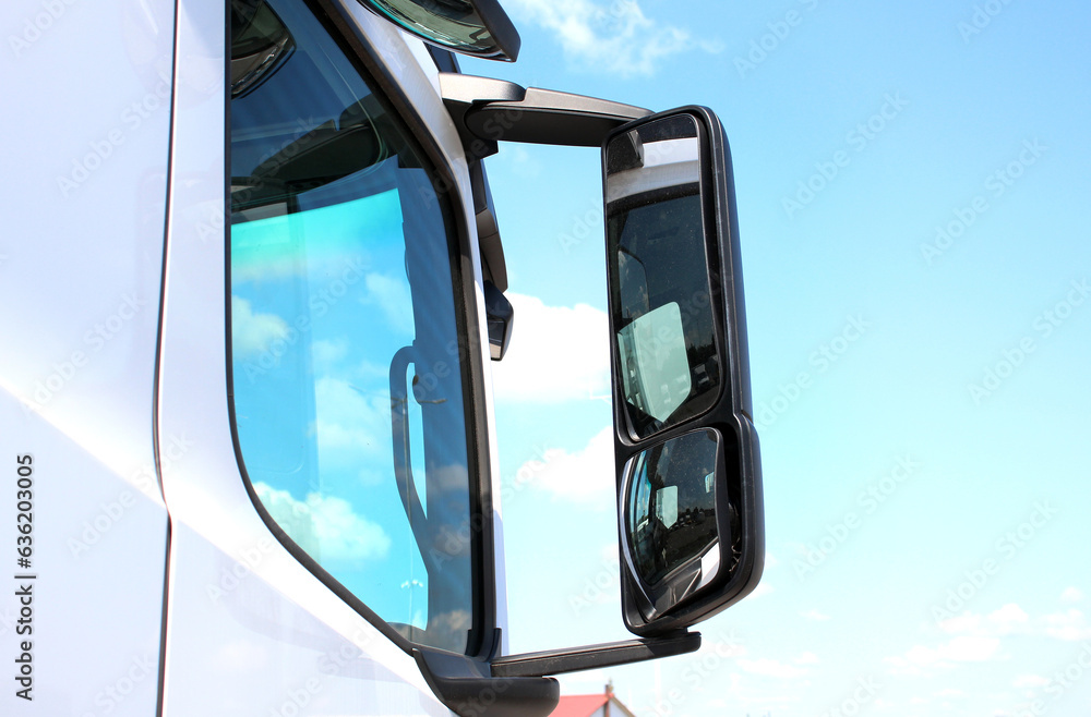 Rear-view mirror on the truck. Large rear view mirror on the truck cab ...