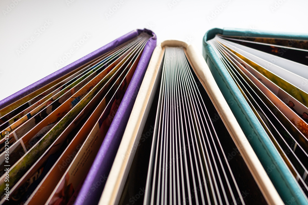 Books. A lot of books with bright covers in one pile isolated on white ...
