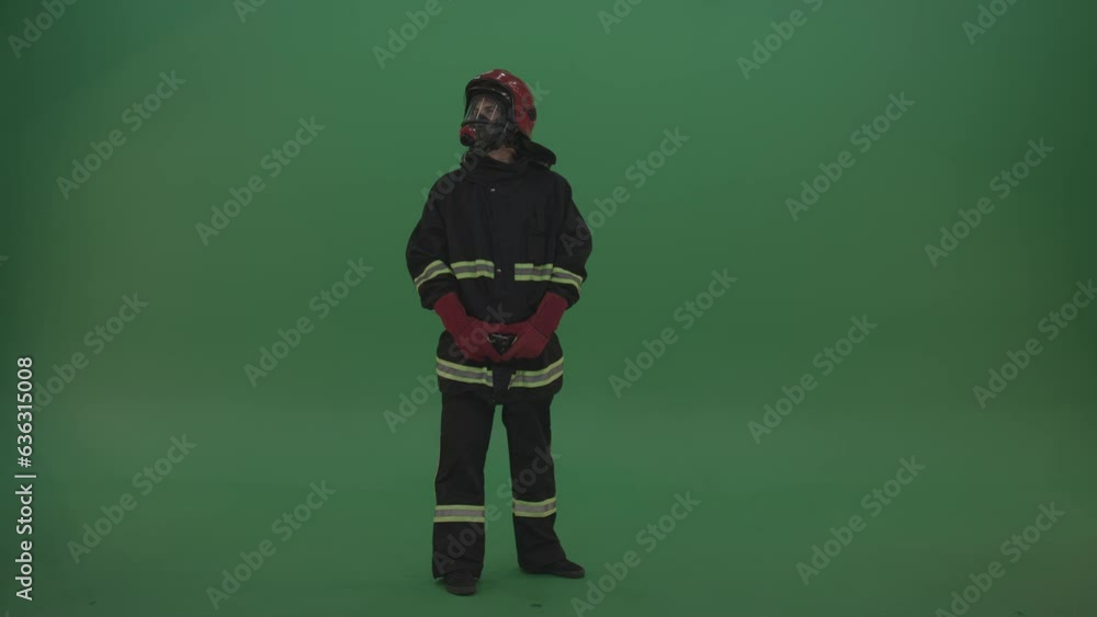 Vidéo Stock firefighter wearing full fireman working kit looking around ...