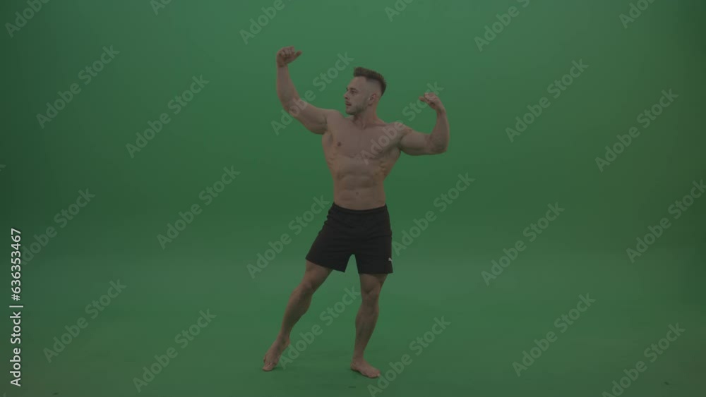 Young blonde bodybuilder demonstrating great double biceps and front ...