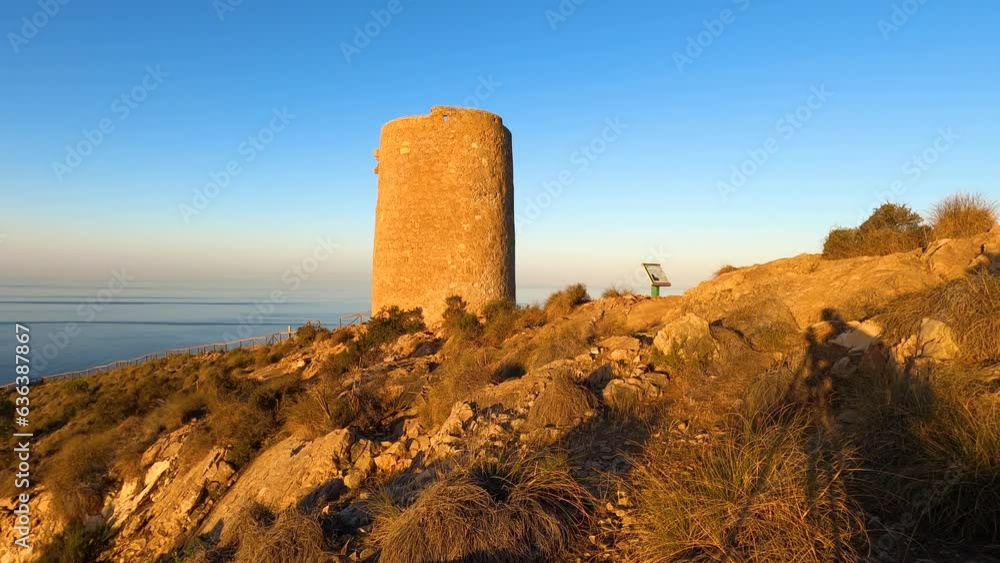 Sunrise over Mediterranean sea. Historic Torre Vigia De Cerro Gordo, a ...