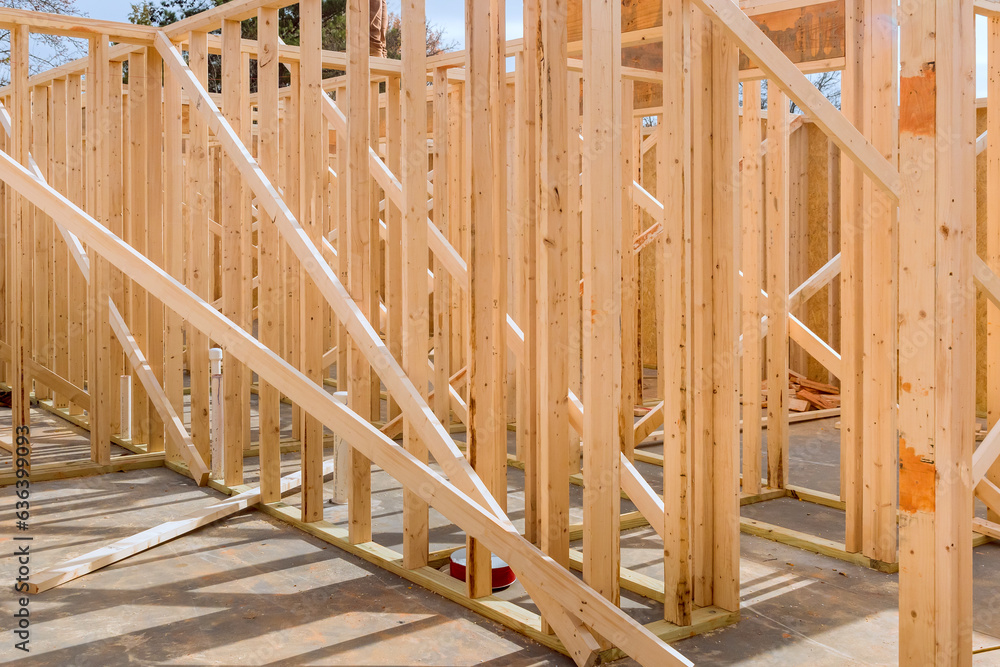 House with wooden framework frame is being constructed with support ...