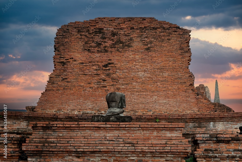 Ancient brick wall with an old headless Buddha statue Stock Photo ...