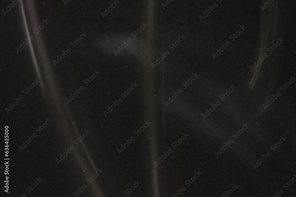 Abstract light streaks flares glowing in dark with vintage film grain ...