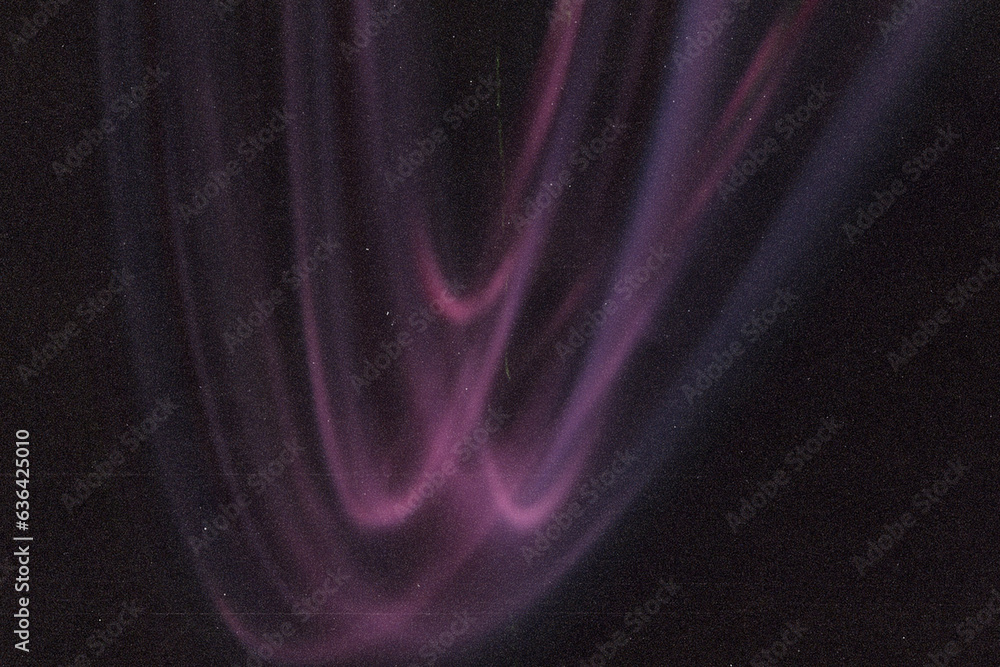 Abstract light streaks flares glowing in dark with vintage film grain ...