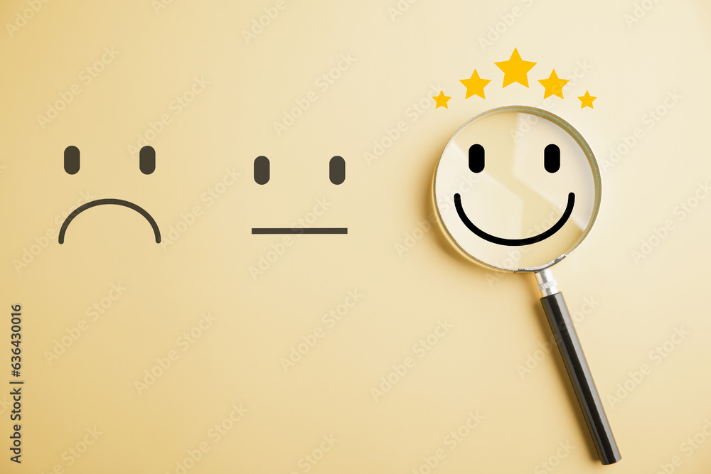 Magnifying glass uncovers smiley face icon, amidst sadness. Customer ...