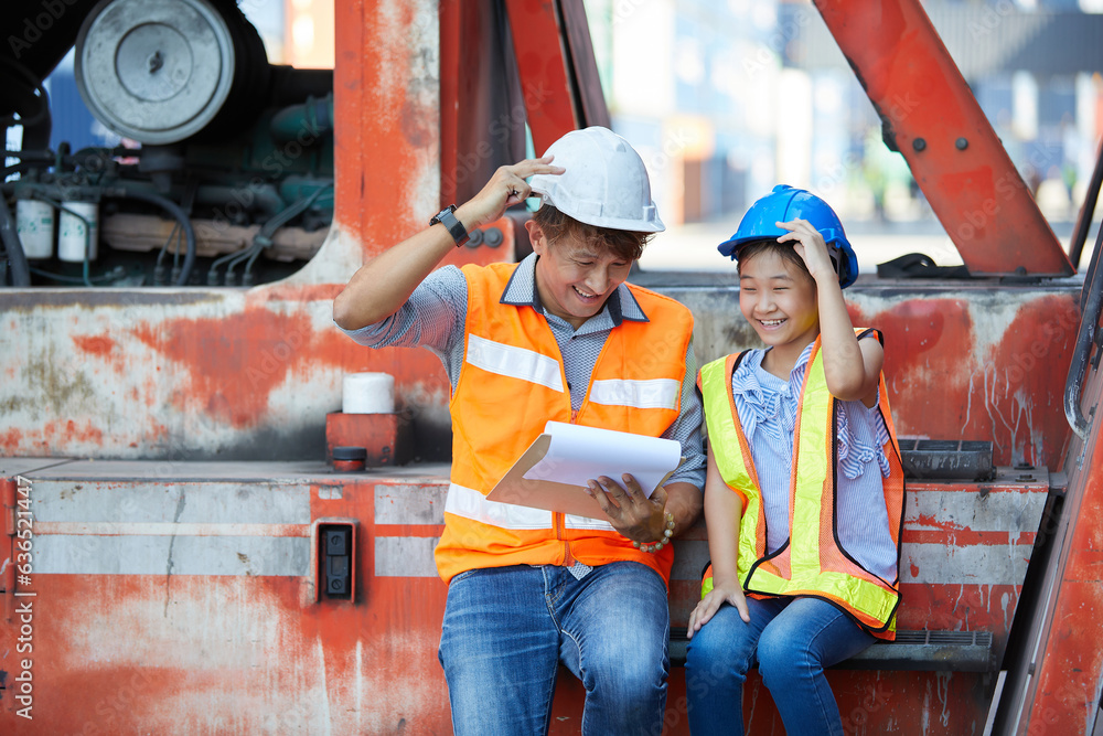 asian engineer with daughter sitting on container cranes Stock Photo ...