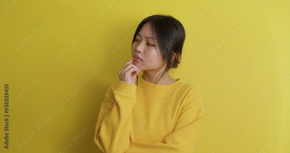 Confused beautiful Asian woman cannot solve problem thinking and ...