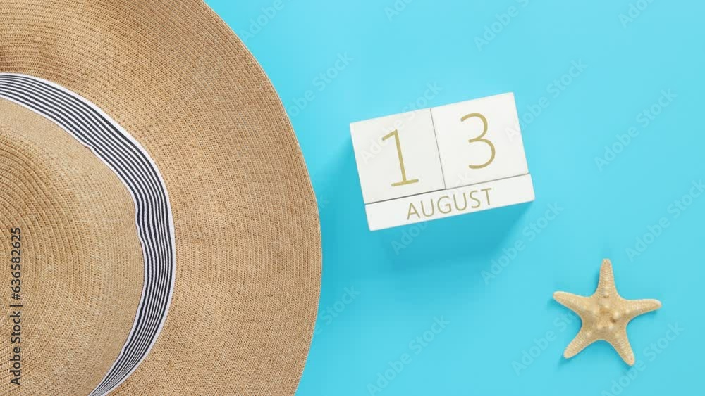 August. Wooden calendar on a blue background with summer accessories ...