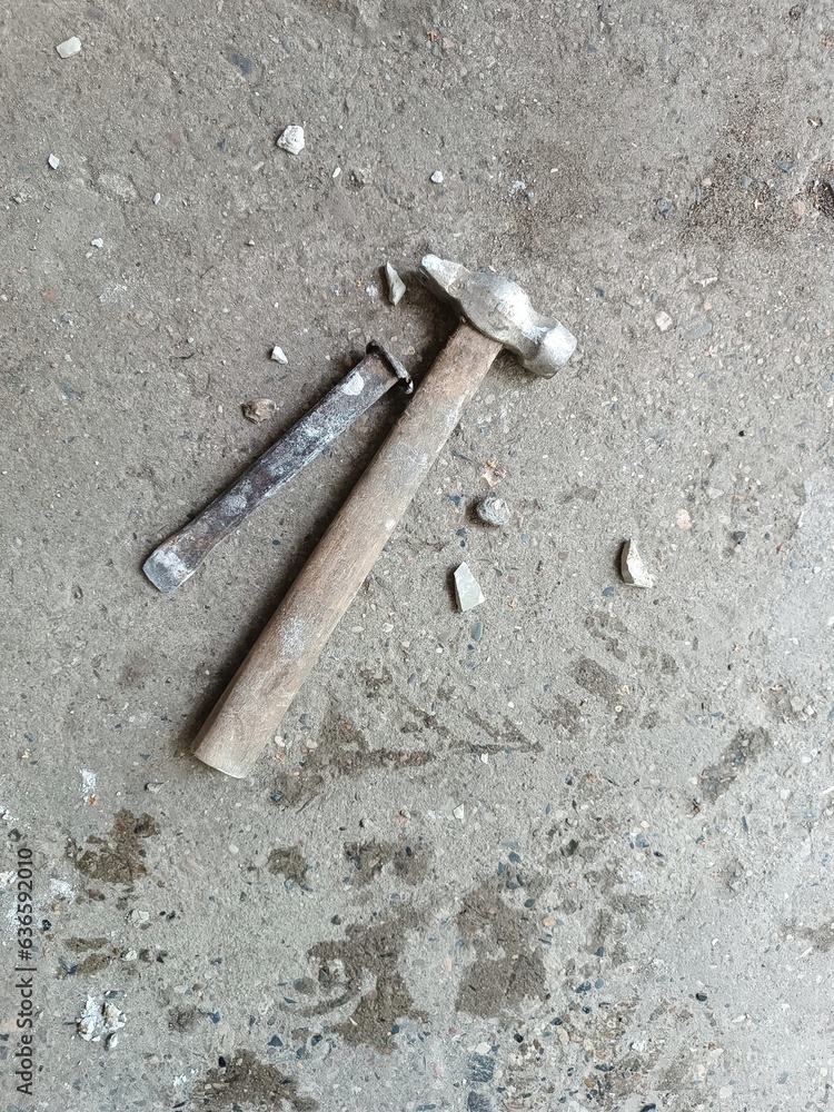 Chisel and hammer on concrete slab. Very old construction tools ...