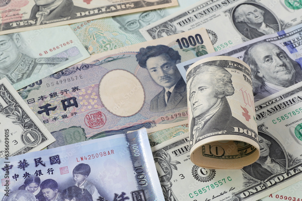 ten dollars paper currency stands on currencies like RMB, Yen, Won ...