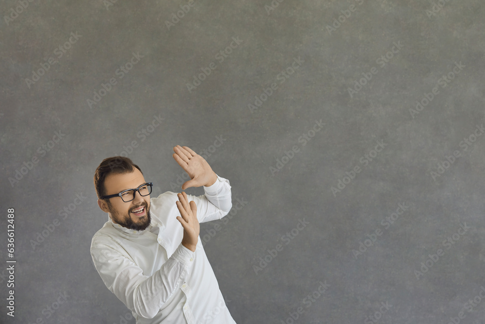 Poster Funny smiling scared cowering caucasian adult man closing hiding ...