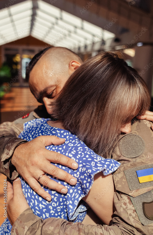 Military kisses. Soldier kisses his girlfriend. Conceptual shot of ...