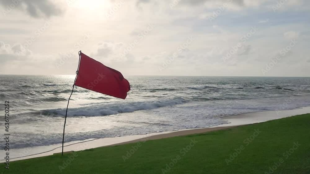 A red flag with heavy windy condition, it is the bad weather warning ...