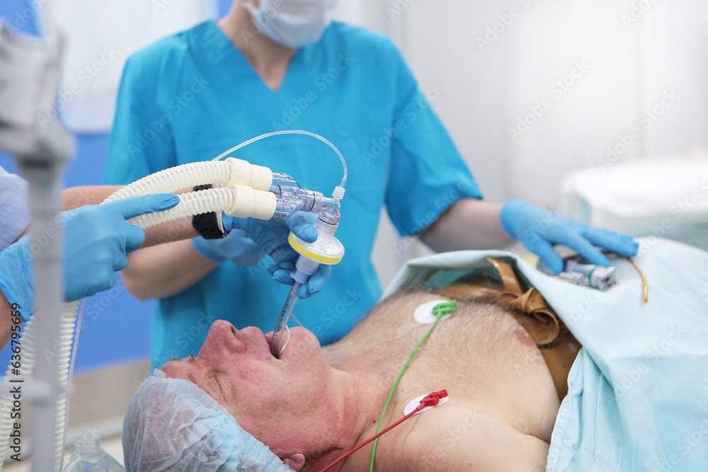 Tracheal intubation.An elderly man before surgery. Preparation for ...