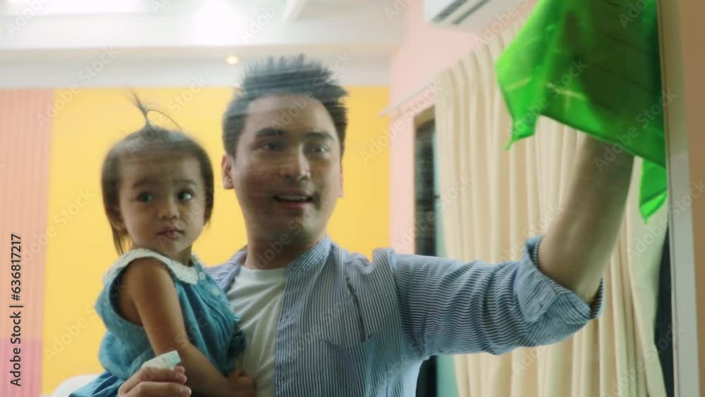 Father's household housework routine chores used a clean cloth to wipe ...