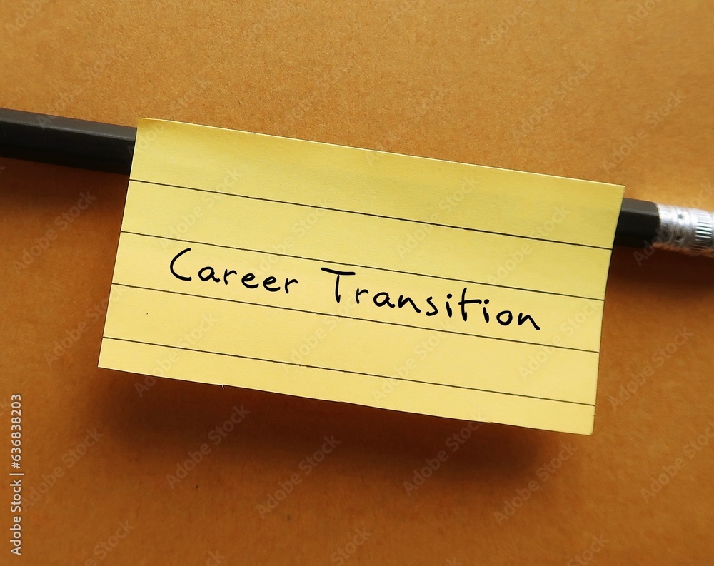 Pencil on office envelope with stick note written CAREER TRANSITION ...