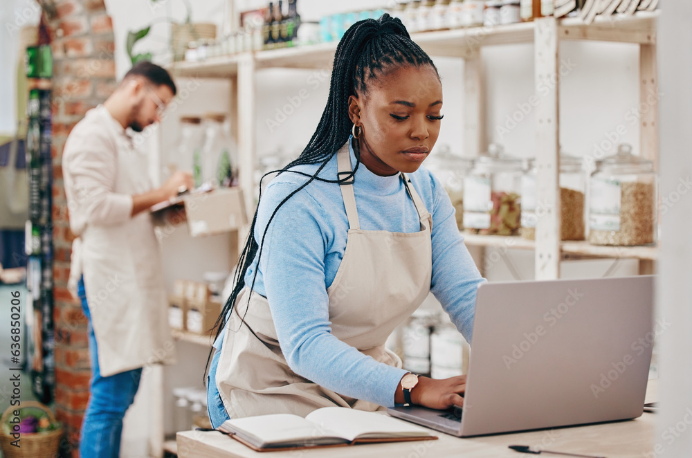 Grocery store, small business and black woman at counter with laptop ...