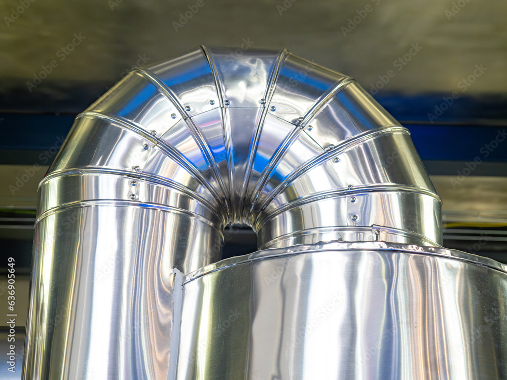 Steel metal pipe. Curved ventilation shaft. Fragment of galvanized ...