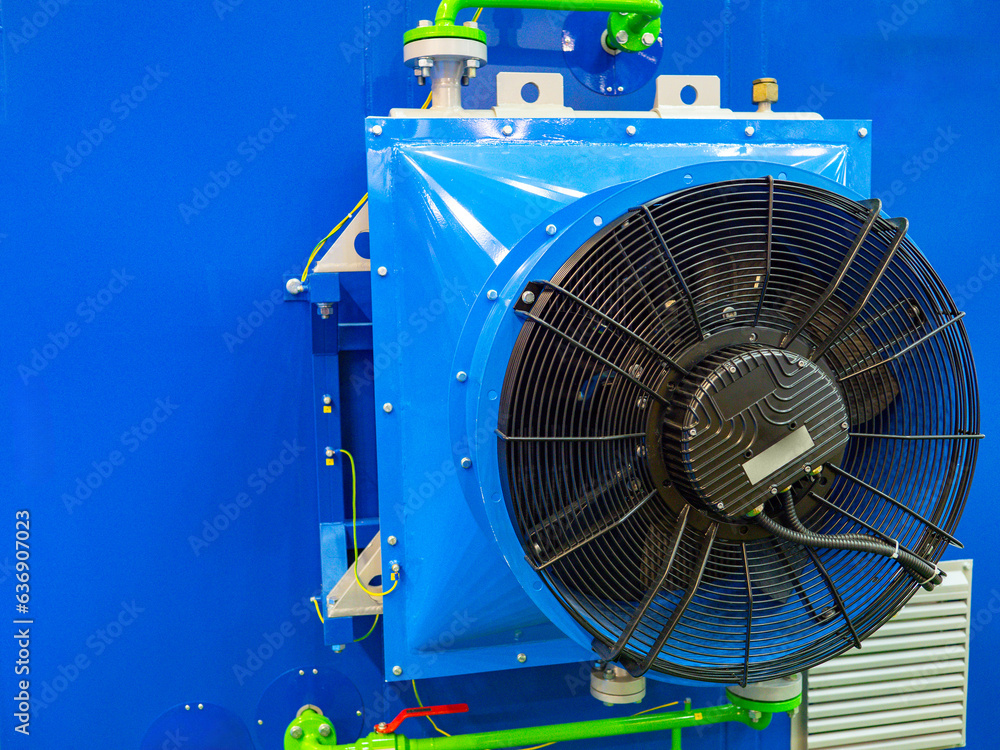 Ventilation equipment. Fan unit on blue wall. Air temperature control ...
