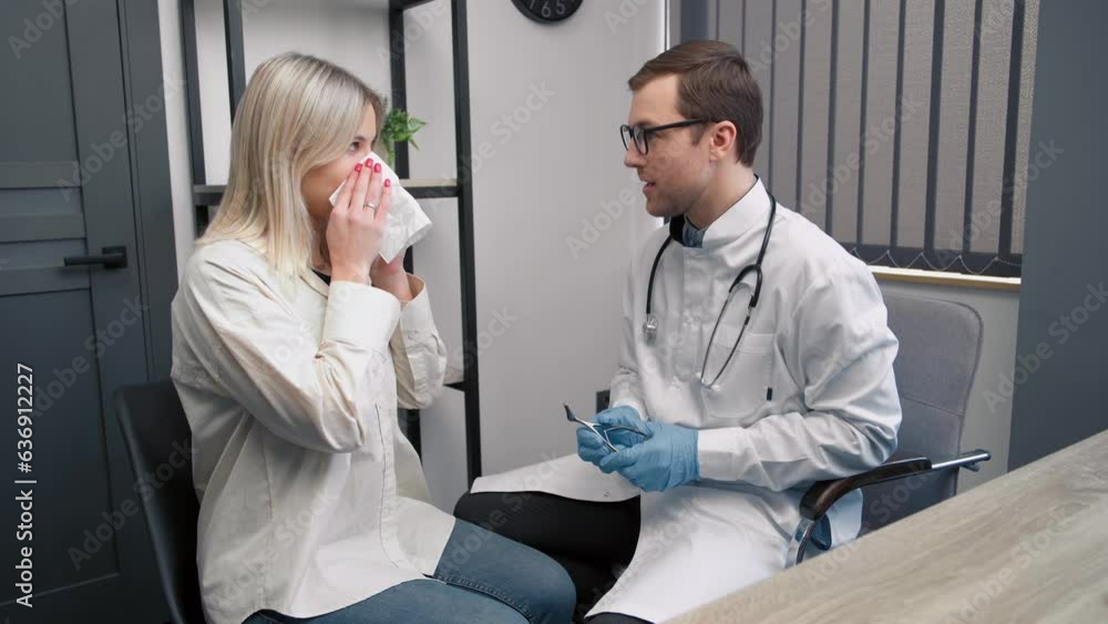 Professional male doctor otolaryngologist doing nose examination with ...