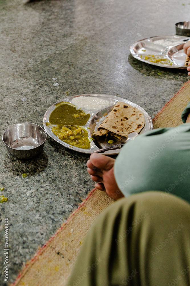 People voluntarily serving langar in India, Asia. Langar is a practice ...