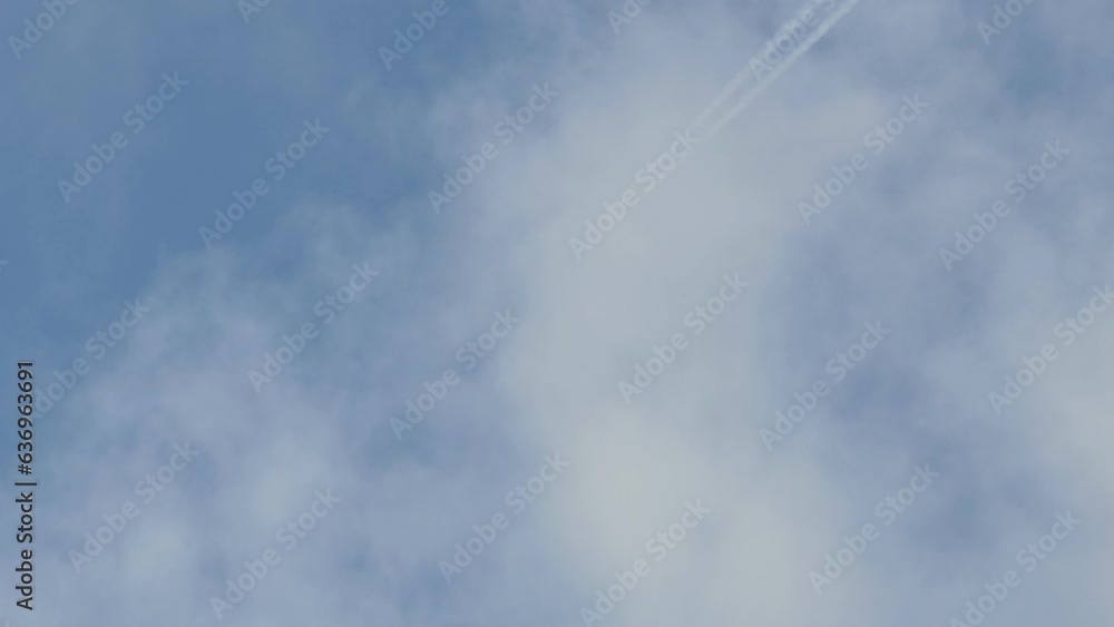 Aviation. A twin-engine passenger jet plane flies above the clouds at ...