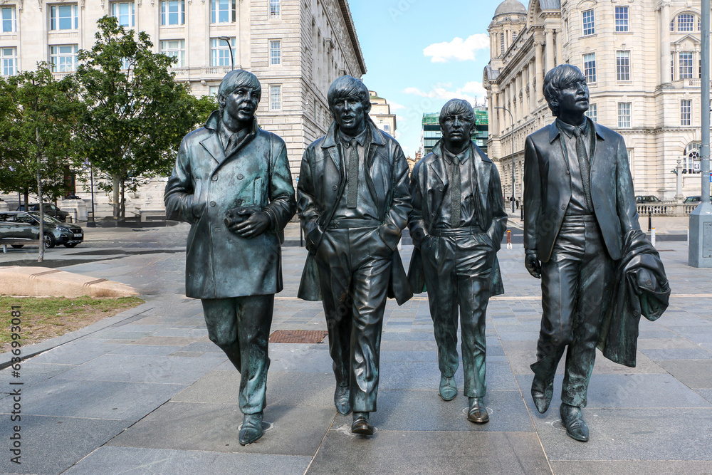 Iconic bronze statue of the Beatles, the Fab Four, walking down Pier ...