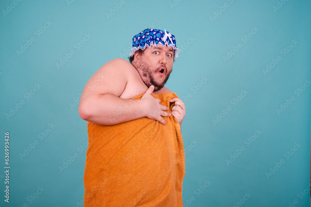 Funny fat man is washing himself in the shower. Blue background. Stock ...