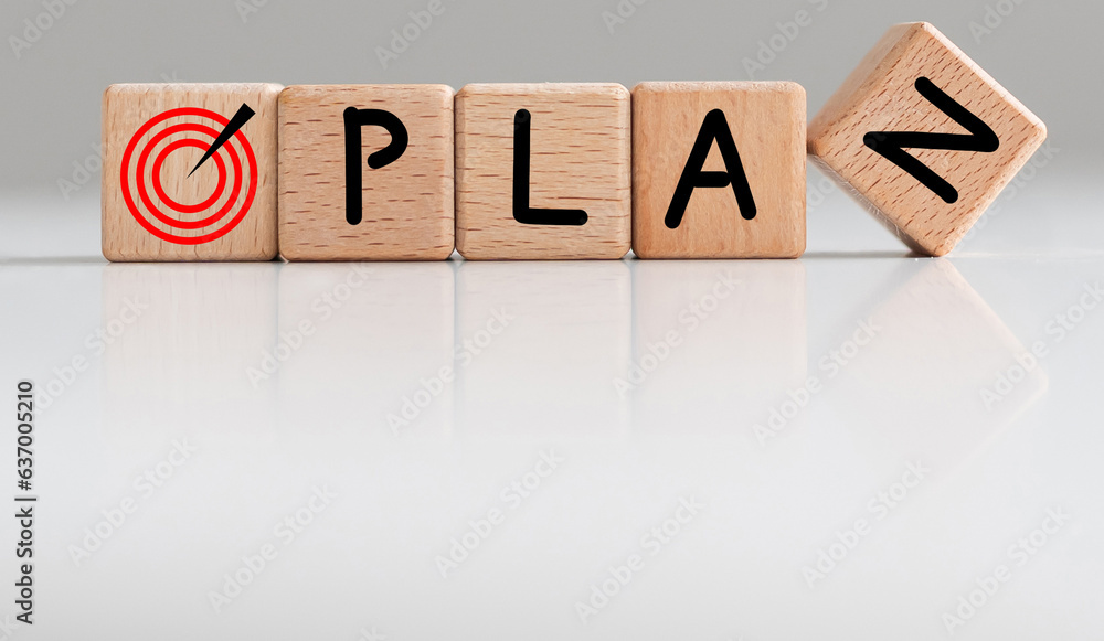 Plans symbol. The concept word 'plans' on wooden cubes on a beautiful ...