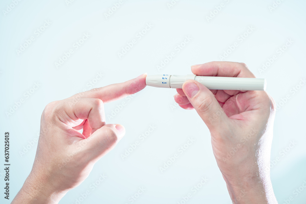 Close-up hand of pregnant woman hold sterile blood lancets and lancing ...