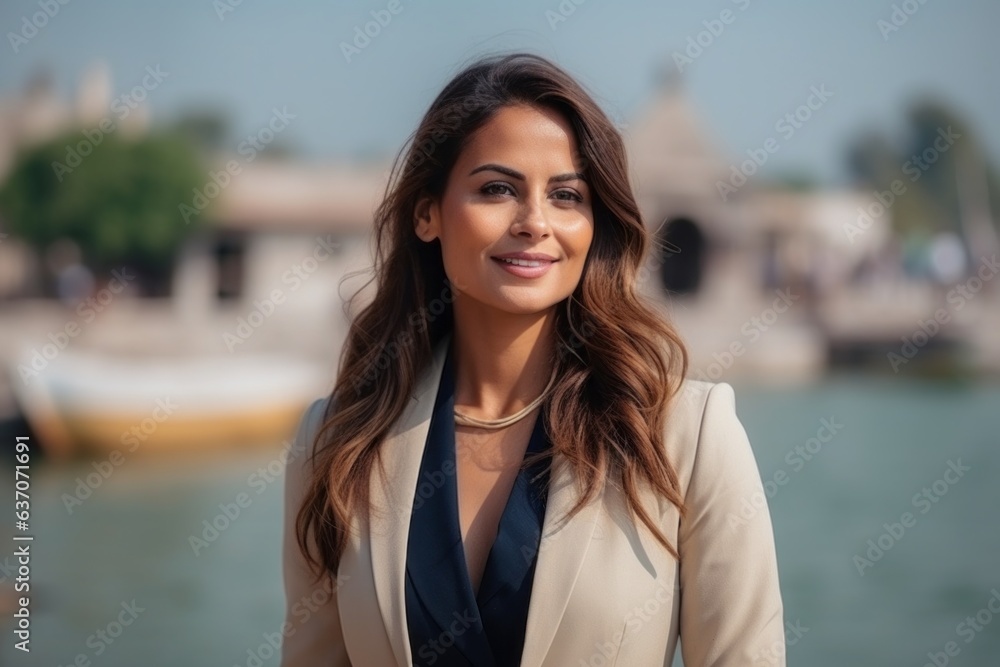 Medium shot portrait of an Indian woman in her 30s in her 30s wearing a ...