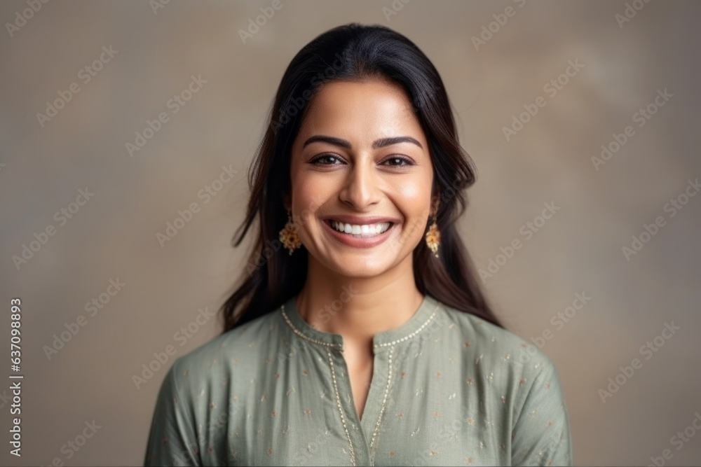 Medium shot portrait of an Indian woman in her 30s wearing kurta pajama ...