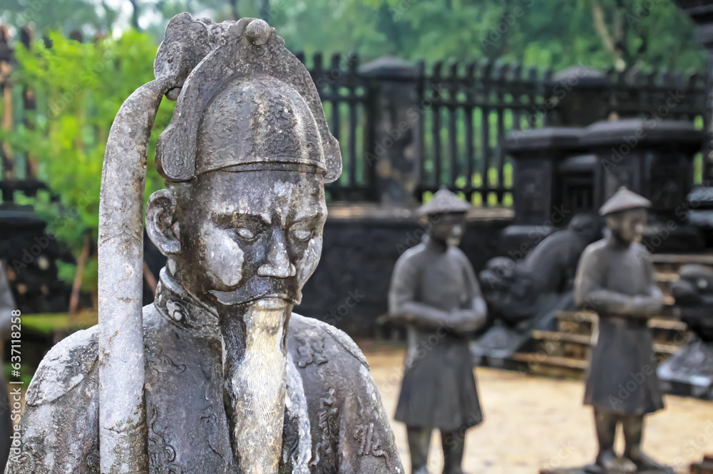 Group of mandarin stone soldier sculptures in yard of mausoleum of ...