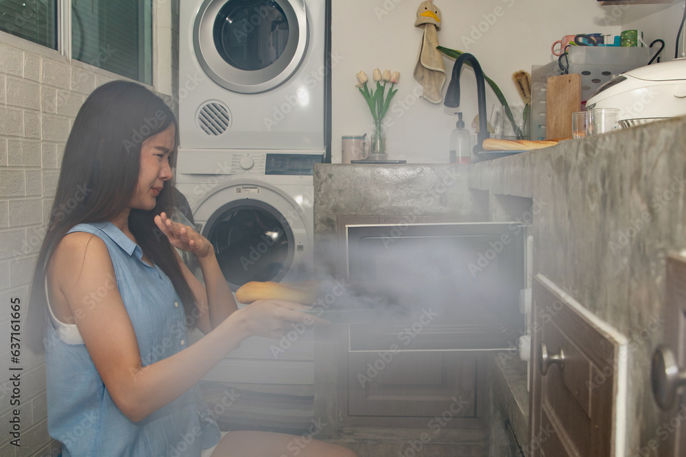Housewife failed to cook : Young Asian housewife in the kitchen baking ...