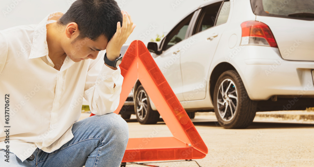 Frustrated asian man wasting time in front red triangle warning sign ...